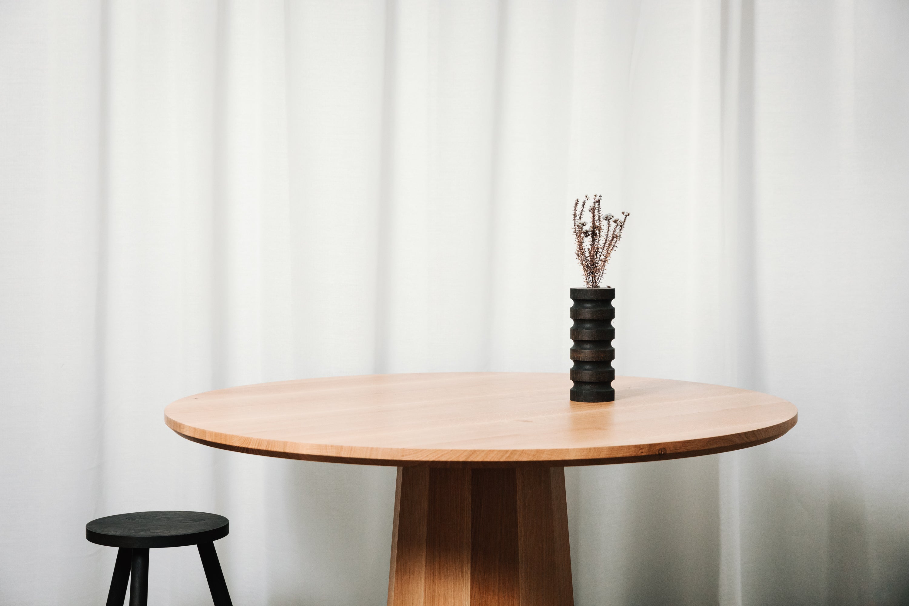 PORTRAIT: POLYGON PEDESTAL DINING TABLE — Galvin Brothers